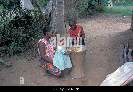 AFRICA KENYA DIGO Young Kenyan mother and two daughters sing as they ...