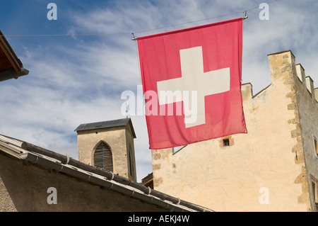 Swiss flag and monastery of Mustair Stock Photo - Alamy