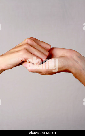Female hands held upwards fingers interlocked together illustrating ...