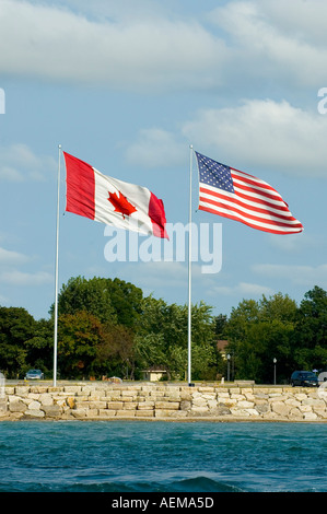The American and Canadian flag fly side by side at Port Huron Michigan ...