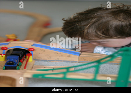 Lewis and his wooden train set Stock Photo - Alamy