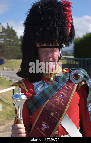 Scottish, colourful red uniformed tartan plaid Scottish pipe band Major ...