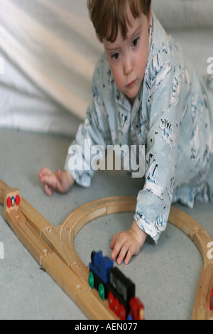Lewis and his wooden train set Stock Photo - Alamy