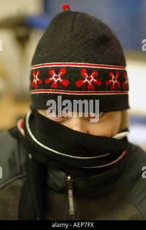 A woman bundled up for freezing cold weather walks on Sixth Avenue in ...