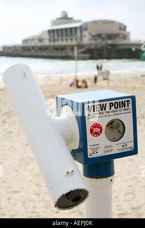View Point telescope with Bournemouth pier, beach and people in the ...