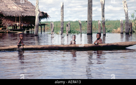 Boy in a canoe on the Sepik River in Papua New Guinea Stock Photo - Alamy
