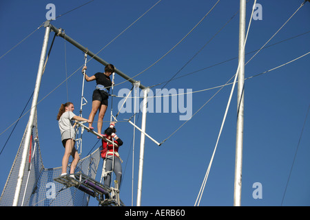 Woman trapeze artist waits on platform Stock Photo - Alamy