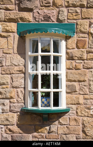Stone bay window with leaded glass at The Lygon Arms hotel in the ...