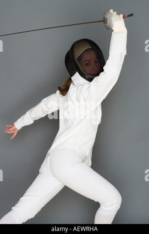 Studio shot of person in fencing outfit Stock Photo - Alamy