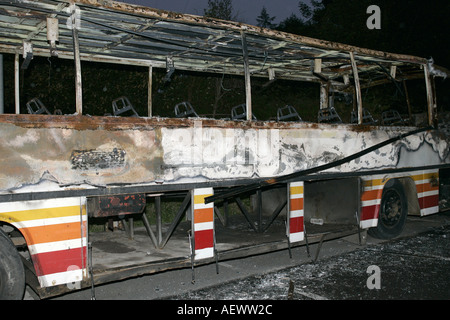 Burned out bus coach at night Belfast Northern Ireland Stock Photo - Alamy