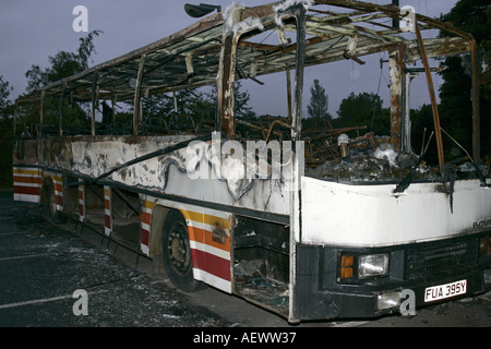 Burned out bus coach at night Belfast Northern Ireland Stock Photo - Alamy