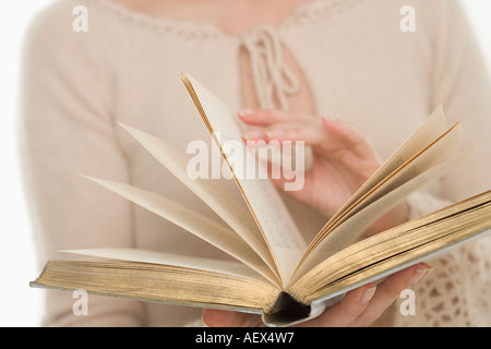 Young woman browsing through books Stock Photo: 10295088 - Alamy