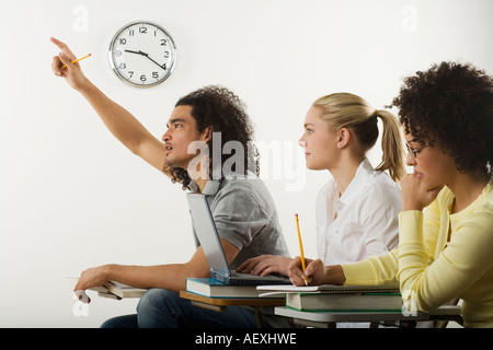 Students in a classroom - handsome student solving a math problem on a ...