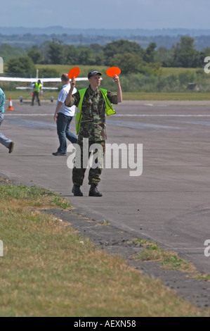 Cadets marshalling aircraft at the PFA Rally Stock Photo - Alamy