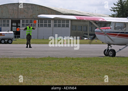 Cadets marshalling aircraft at the PFA Rally Stock Photo - Alamy