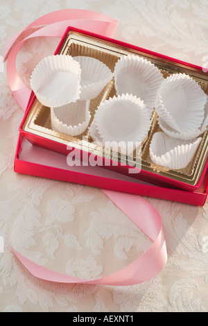 Empty box of chocolate sweets with candy paper cups isolated on white ...