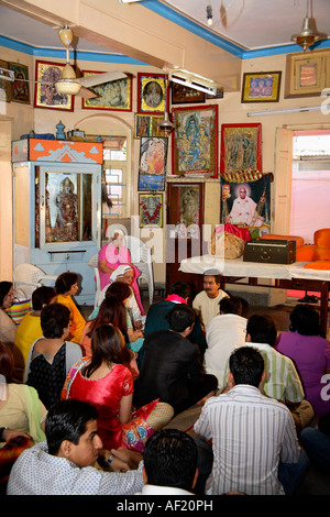 Priest conducting a Upanayana (thread ceremony) for young male hindu ...
