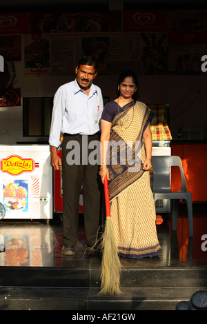 Indian woman shopkeeper posing in her colourful cloth shop at Ponda ...