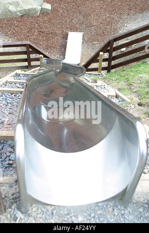 Chute in children's playground Stock Photo - Alamy