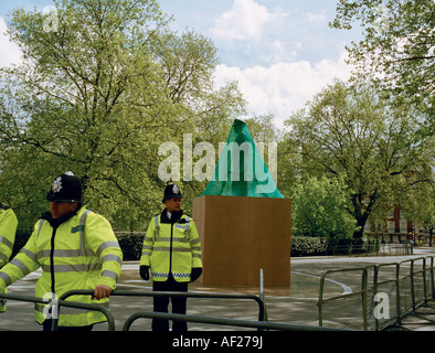 Policemen protect the British Embassy during a protest by hardline ...