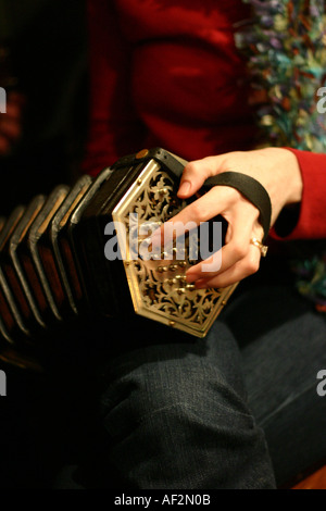 Woman playing concertina accordian Stock Photo - Alamy