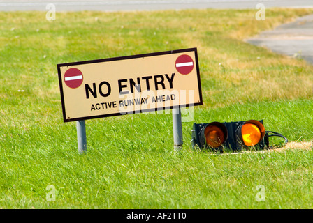 No Entry Active Runway Ahead sign with flashing amber lights at ...