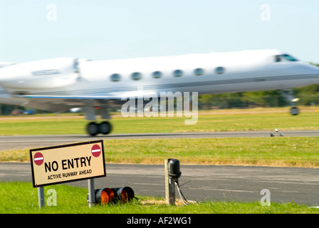 No Entry Active Runway Ahead sign with flashing amber lights at ...