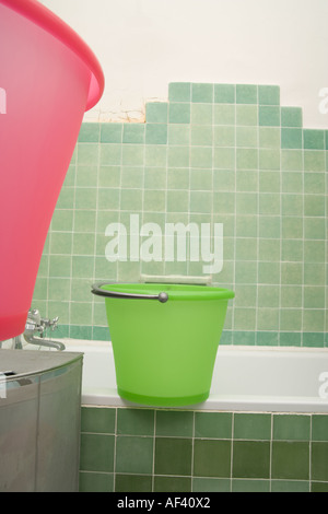 Two buckets on bath Stock Photo - Alamy