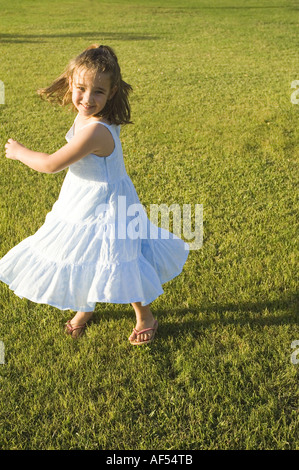 smiling girl with long hair dancing together with friend on warm summer ...