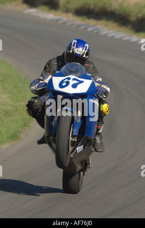 Superbike rider pulling a wheelie Stock Photo - Alamy