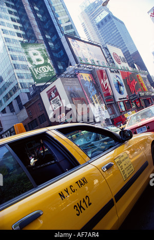 New York City yellow cab taxi parked curbside awaiting passengers near ...