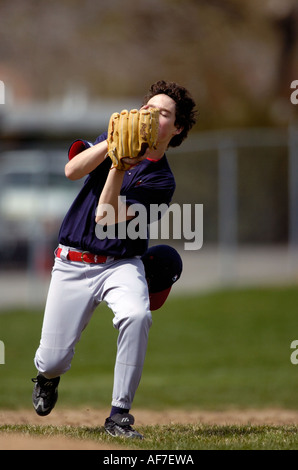 Baseball Player with a blue uniform on baseball Stadium Stock Photo - Alamy