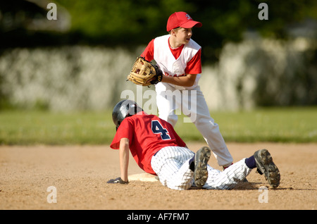 Baseball player sliding into base Stock Photo - Alamy