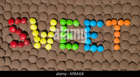 sweets and chocolate used to spell out the word fat Stock Photo - Alamy
