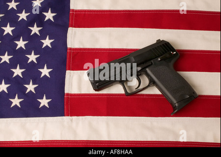 Hand gun with flag Stock Photo - Alamy