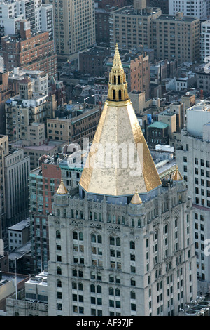 The gilded roof of the New York Life Insurance building stands out in ...