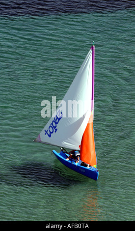 Sailing dinghy with orange sail in the Gulf of Morbihan, Brittany ...