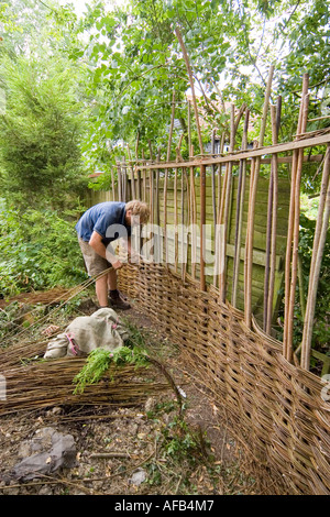 Building an Osier garden fence Stock Photo - Alamy