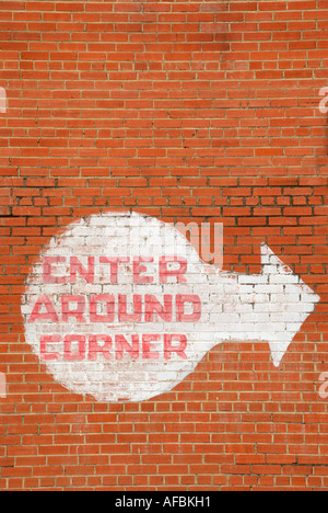 Old worn red arrow symbol yellow background, leading the eye's way ...