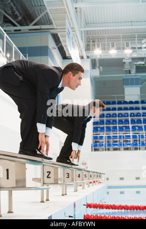 Businessmen on starting blocks Stock Photo - Alamy