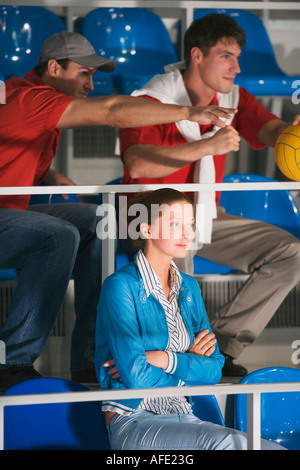 Spectators watch the 2-Up game as part of Anzac Day celebrations at ...