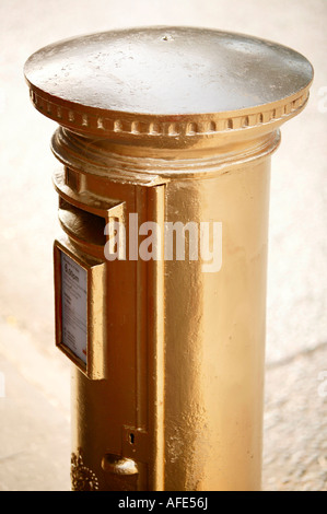Post Box Painted Gold, Norwich, UK Stock Photo - Alamy