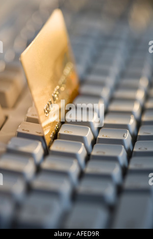 Credit cards with computer keyboard on grunge background, closeup ...