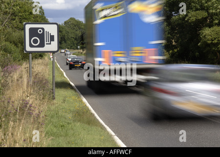 Traffic on the A75 passing speed camera sign Stock Photo - Alamy
