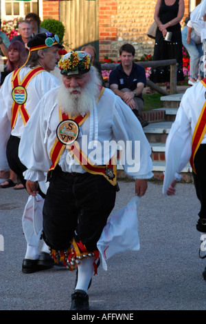 An elderly man in a folk costume passing motorbike fans, Moravia, Czech ...