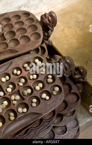 Mancala board game, stones Stock Photo - Alamy