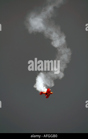 Radio controlled stunt plane performing an aerobatic display loop the ...