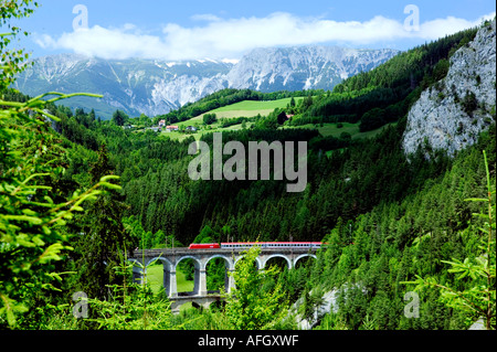 view of a railroad bridge of the semmeringbahn railway in austria which ...
