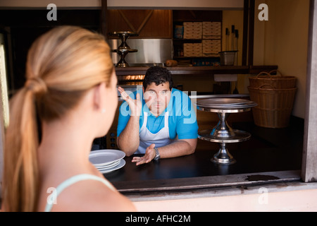 Chef interacting with customer Stock Photo - Alamy