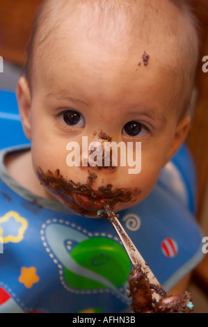 A toddler or a child ate chocolate with a messy face Stock Photo - Alamy